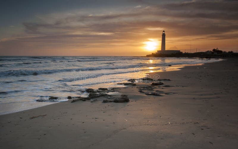 Lighthouse and sunset stock image. Image of clouds, beautiful - 87887333