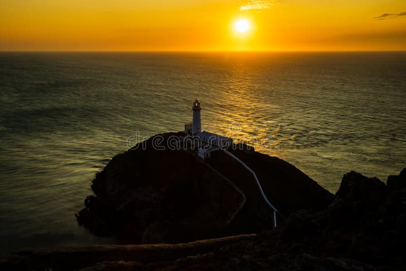 Lighthouse at sunset stock photo. Image of peninsula - 201332662