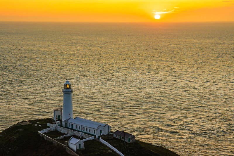 Lighthouse at sunset stock image. Image of landscape - 201332671