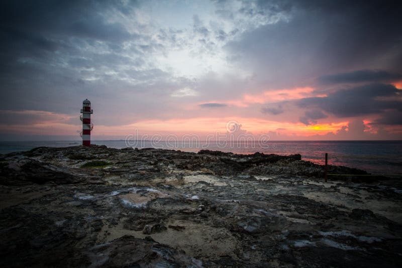 Lighthouse at sunset stock image. Image of ocean, cloudscape - 44477115