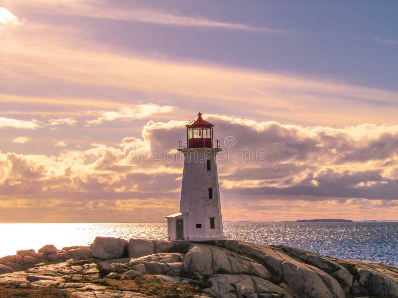Lighthouse Sunset stock image. Image of rocks, pink, lighthouse - 87763125