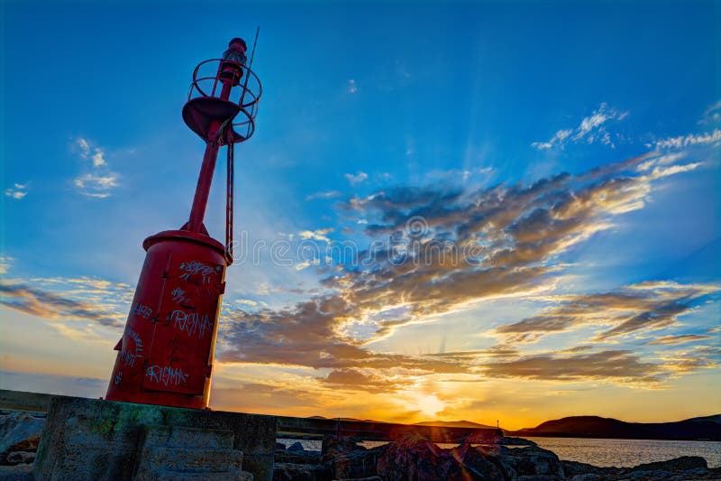 Lighthouse at sunset stock image. Image of glowing, harbor - 43230611