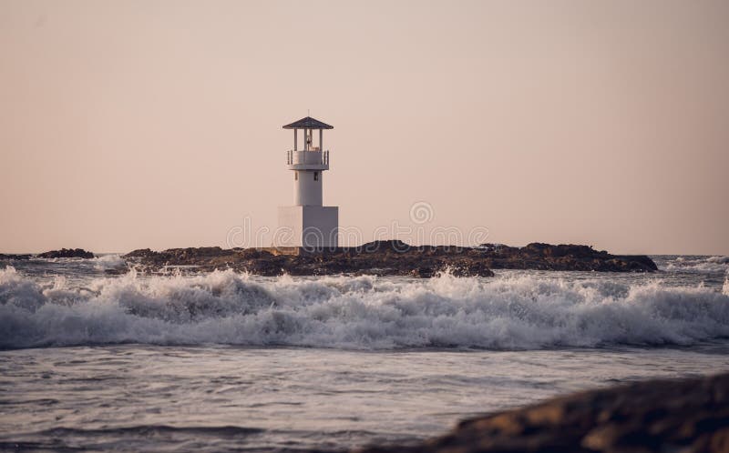 Lighthouse Surrounded by Water and Cloudy Sunset Sky Stock Image ...