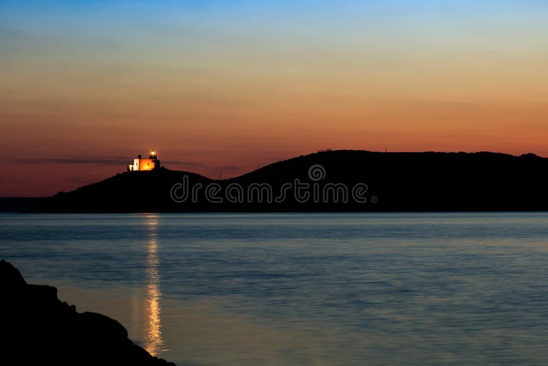 Lighthouse on top of land stock image. Image of pastel - 72299547