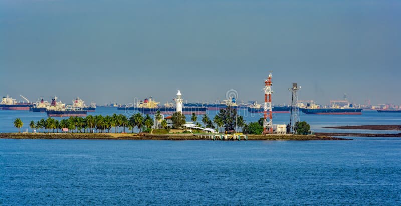 Lighthouse on Tropical Island Stock Photo - Image of white, wave: 129162492