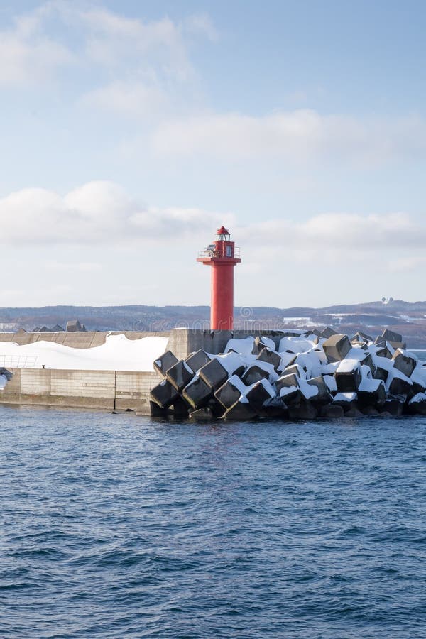 Lighthouse in winter scene stock photo. Image of coastline - 41098386