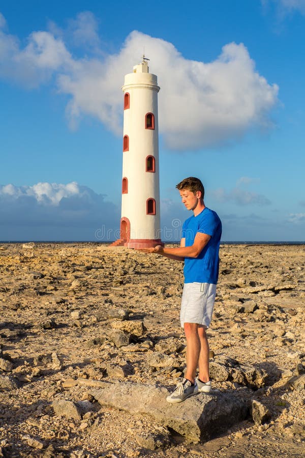 Lighthouse and Man at Rocky Coast Stock Image - Image of caucasian ...