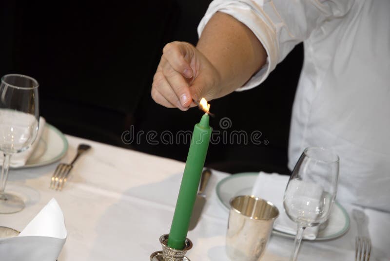 Lighting a candle stock photo. Image of cook, matchstick - 1186404