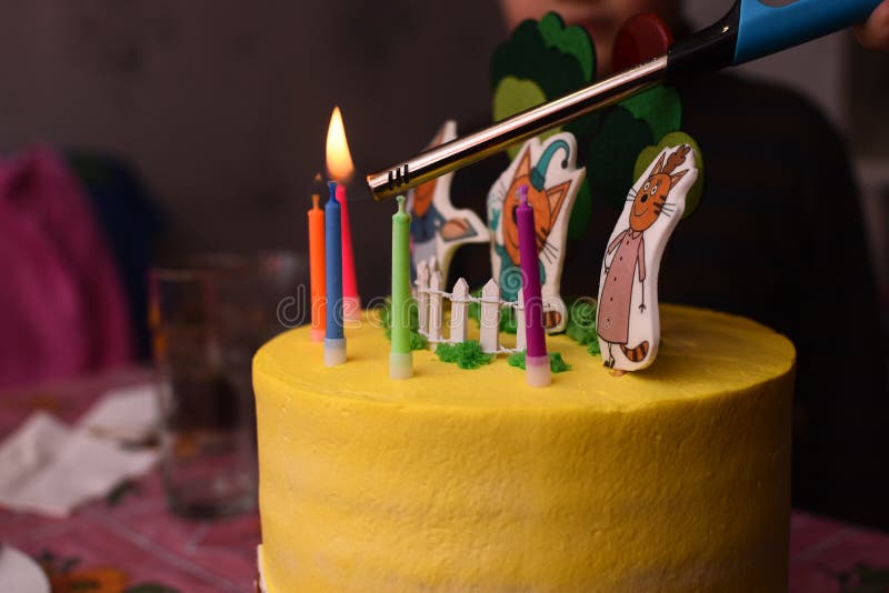 Lighting Candles on a Cake with a Lighter. Stock Image - Image of ...