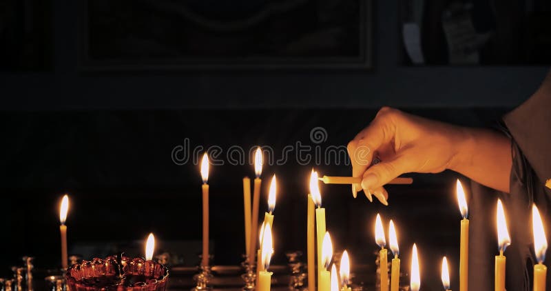 Lighting Candles Symbolizing Deep Faith and Spiritual Devotion in a ...