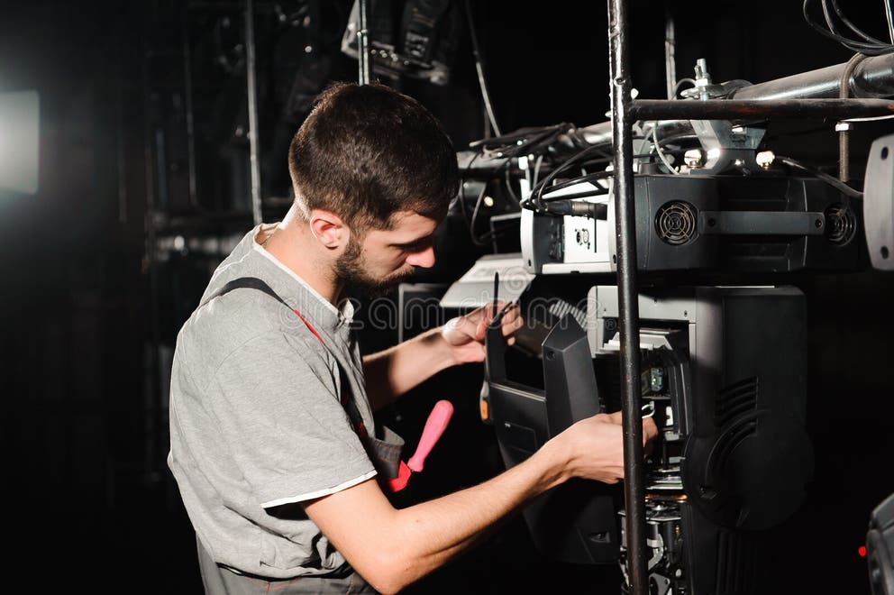 The Lighting Engineer Adjusts the Lights on the Stage. Stock Photo ...