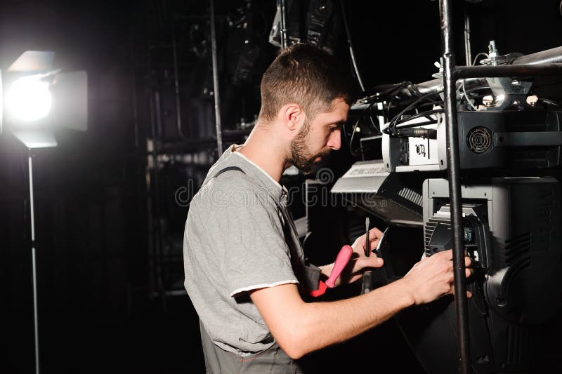 The Lighting Engineer Adjusts the Lights on the Stage. Stock Image ...