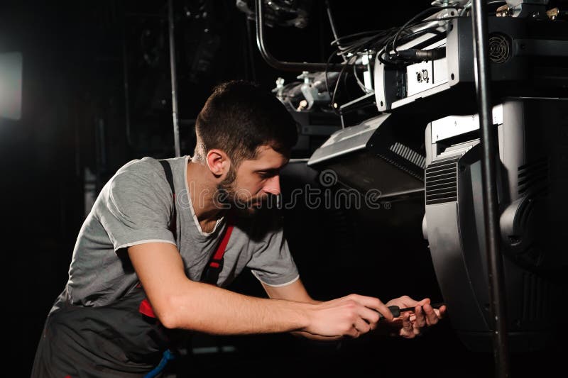 The Lighting Engineer Adjusts the Lights on the Stage Stock Photo ...