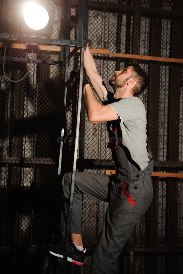 The Lighting Engineer Adjusts the Lights on Stage Behind the Scenes ...