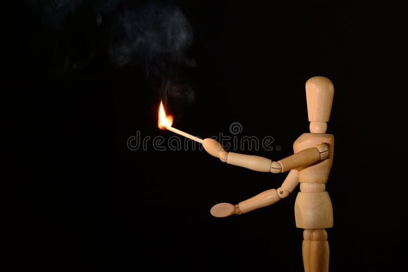 Lighting a Match Against a Black Background Stock Photo - Image of fire ...