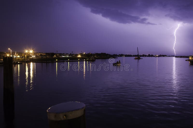Lighting Strike Over Harbor with Purple Sky Stock Photo - Image of ...