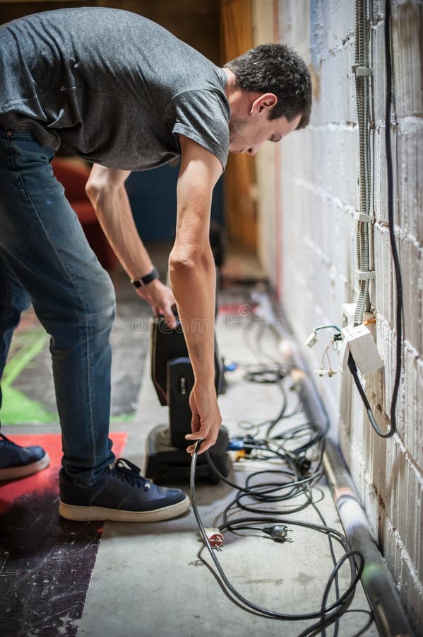 Lighting Technician Electric Engineer Adjusting Focus of Lighting ...