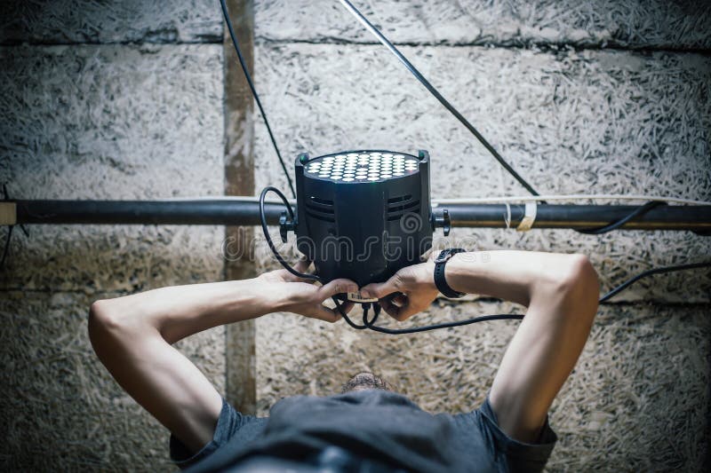 Lighting Technician Electric Engineer Adjusting Focus of Lighting ...