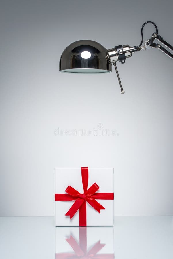 Lighting Up Gift Box Present with Desk Lamp Stock Image - Image of ...