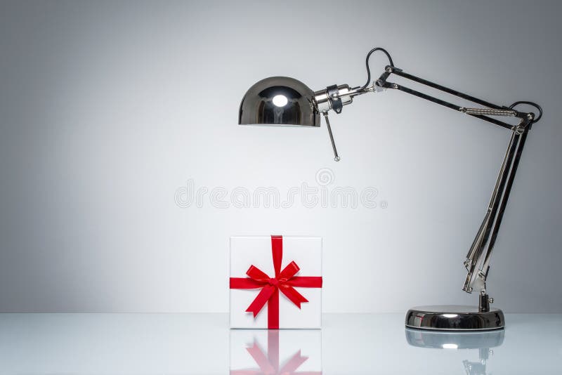 Lighting Up Gift Box Present with Desk Lamp Stock Image - Image of ...