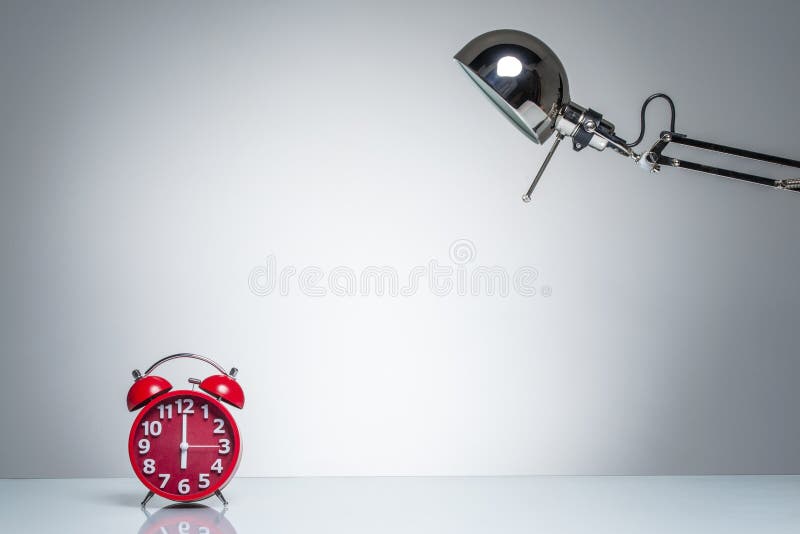 Lighting Up Red Alarm Clock with Desk Lamp Stock Image - Image of ...