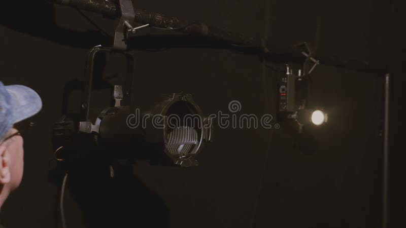 The Lighting Worker Hangs a Profile Spotlight on the Instrument Stand ...