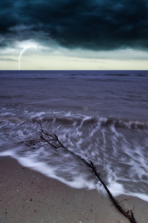 Lightning on the Beach stock photo. Image of waves, bench - 202498636