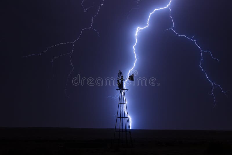 Lightning Bolt Striking Behind a Windmill Stock Photo - Image of ...