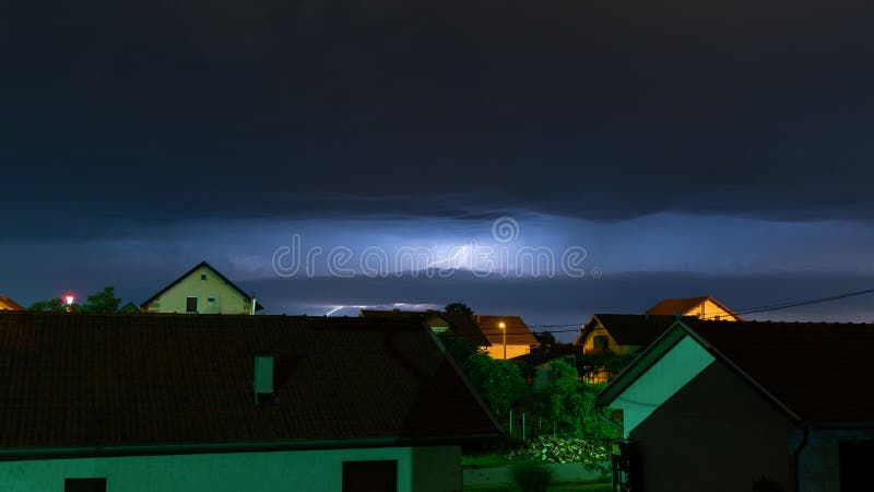 Lightning Glow in Clouds Above Suburbs at Night Stock Photo - Image of ...