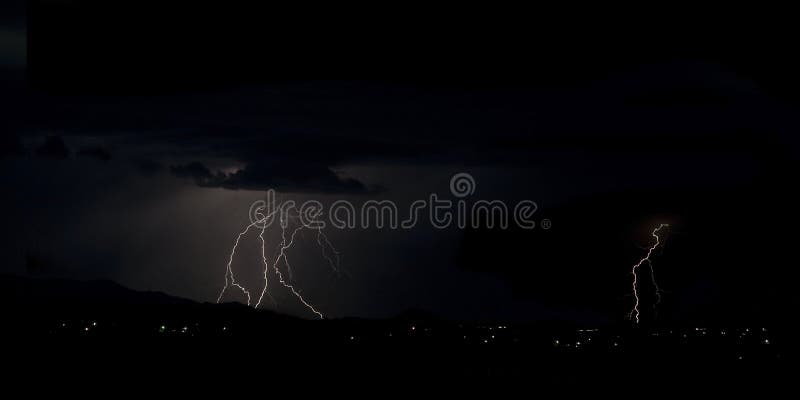 Lightning over city lights stock photo. Image of nature - 59324216