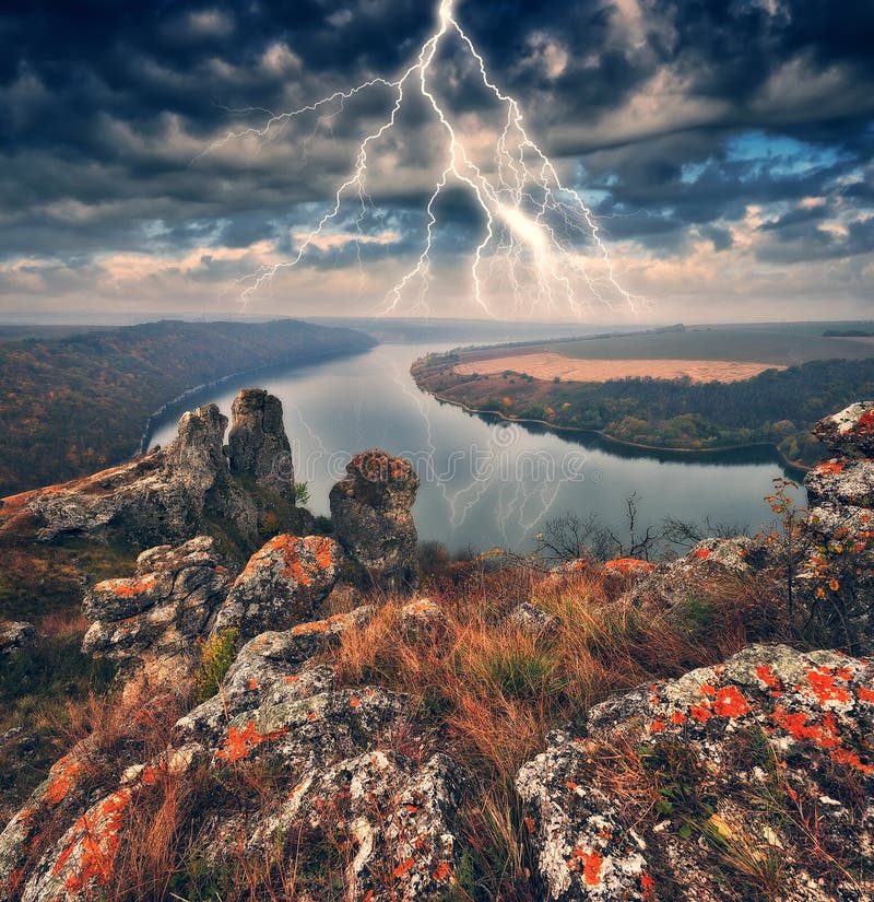 Lightning Over a Hilly Field. Landscape with Dramatic Thunderclouds in ...