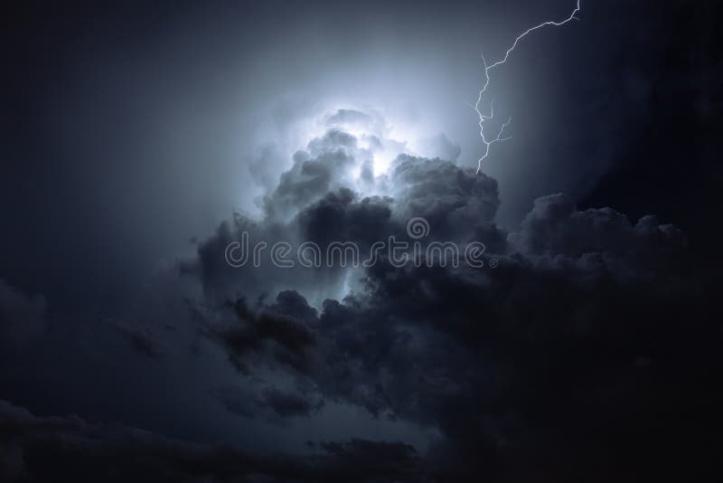 Lightning Radiates through the Clouds at Night Stock Image - Image of ...