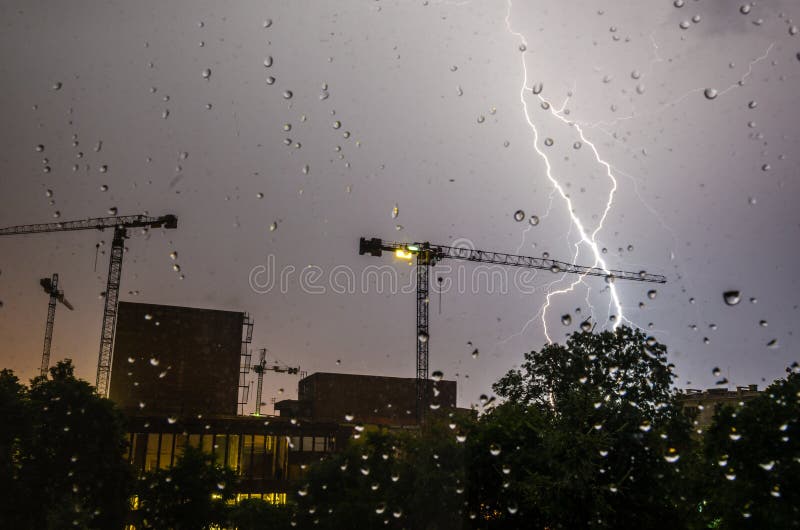 Lightning, Raindrops and Construction Stock Photo - Image of storm ...