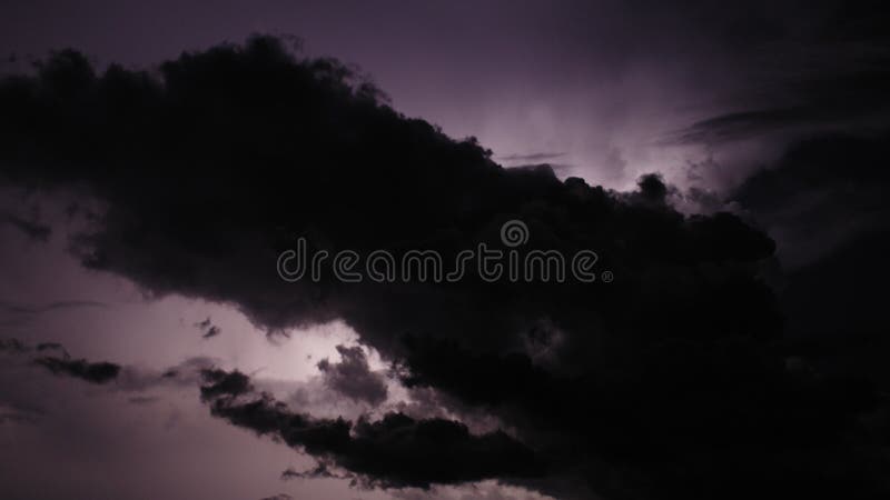 Lightning in the Sky in the Clouds during a Night Storm Stock Footage ...