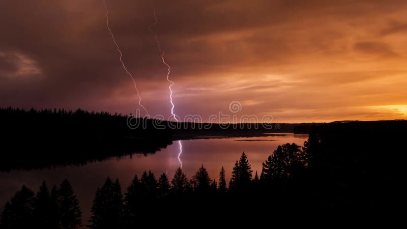 Lightning Strike Over Lake at Sunset Stock Video - Video of light ...