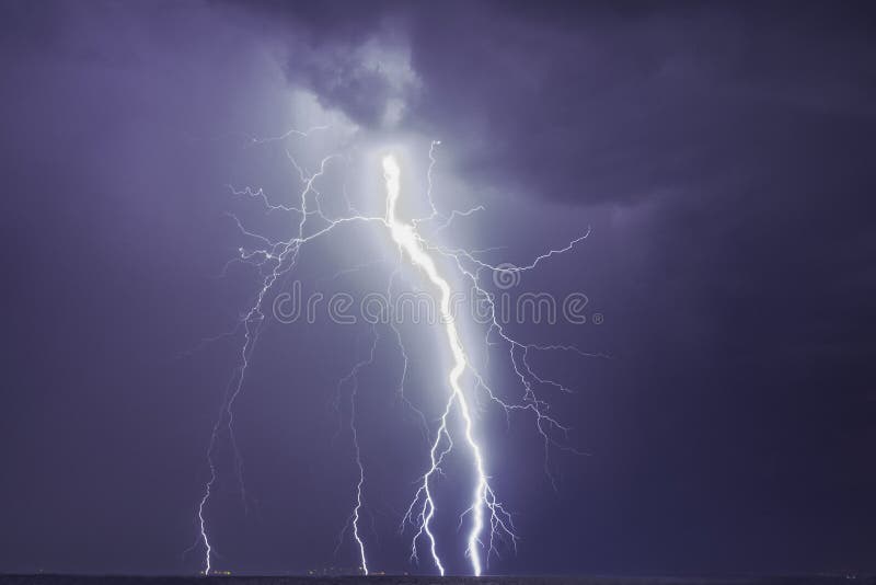 Lightning Strike on a Lake stock photo. Image of storm - 154326454