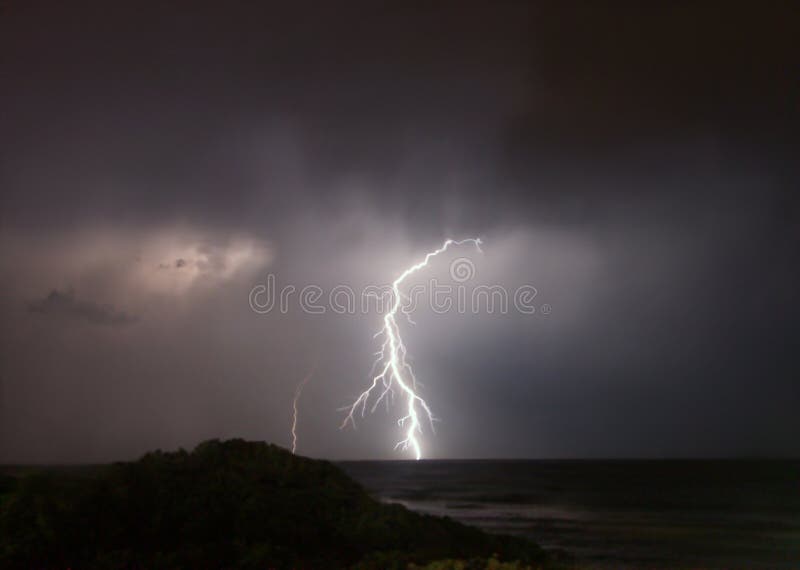 Lightning strike at sea stock photo. Image of lightning - 418334