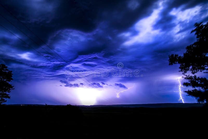 Lightning Strikes in the Evening Stock Photo - Image of power, clouds ...