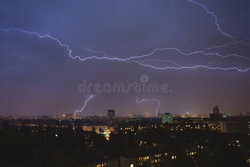 Lightning Strikes Over Night Town during a Stock Image - Image of ...