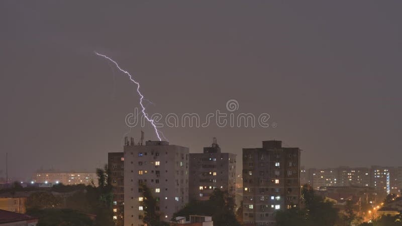 Lightning Strikes Over a City Skyline during a Dramatic Storm at ... Lightning Strikes Over a City Skyline during a Dramatic Storm at ...