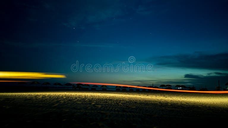Lights on the beach stock image. Image of dengan, horizon - 215204387