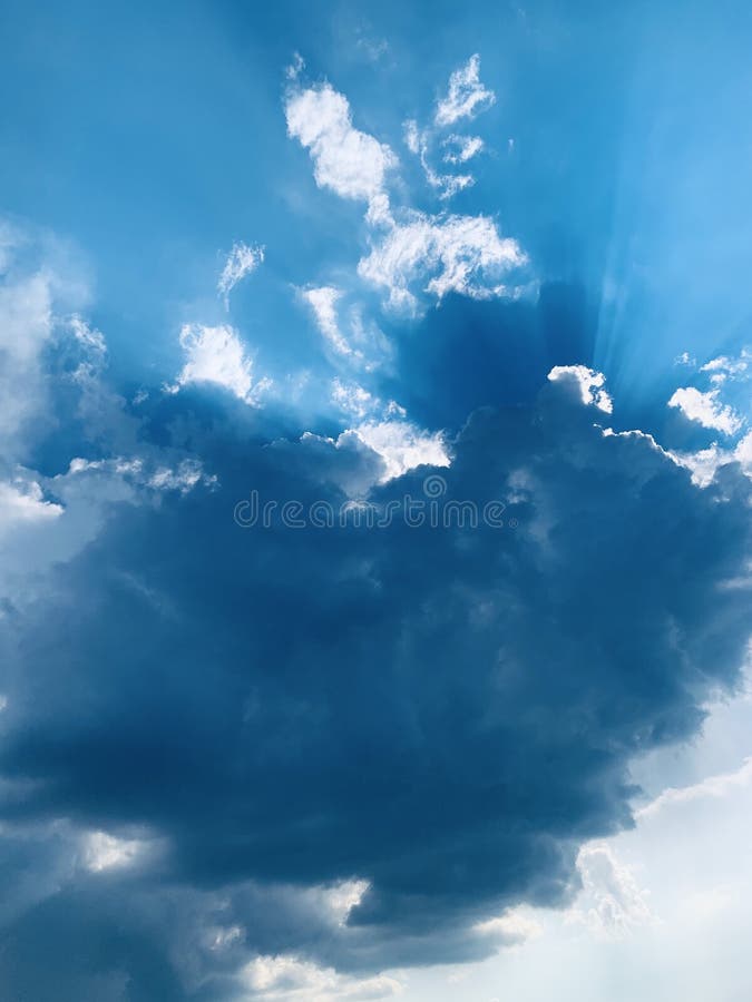 Lights Come through the Clouds Stock Photo - Image of sunny, back ...