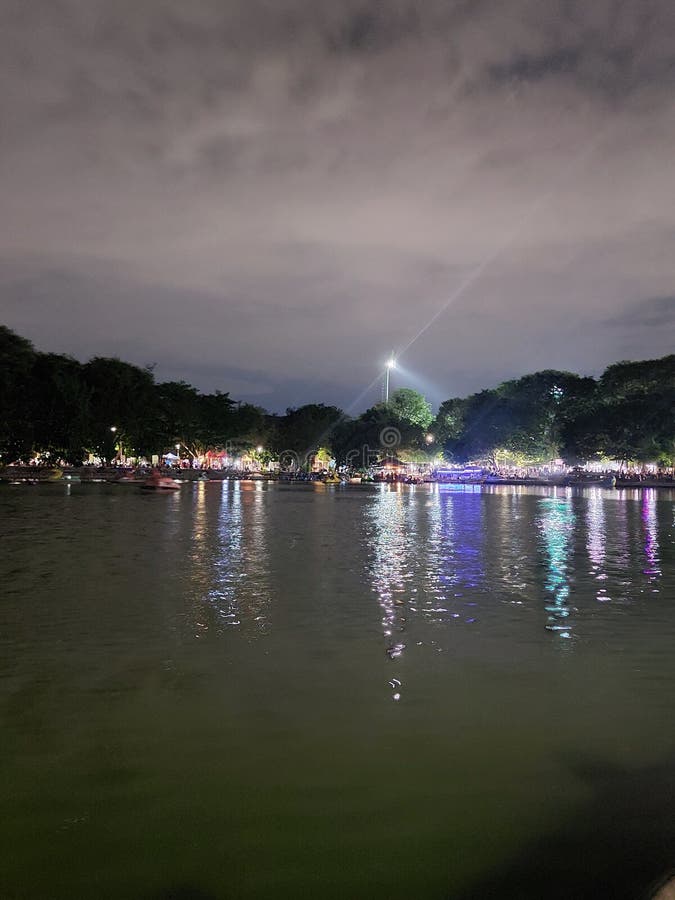 The Lights that Light Up on the Edge of the Lake at Night Stock Image ...