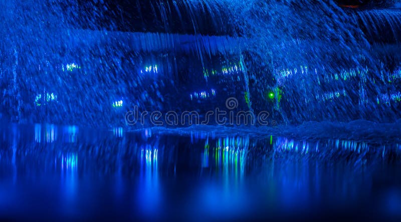 Lights Reflected Blue in the Water in Night Light. Stock Photo - Image ...