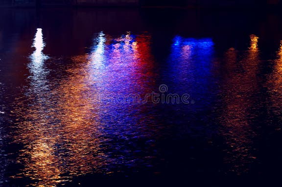 Lights reflecting on water stock photo. Image of reflecting - 694174