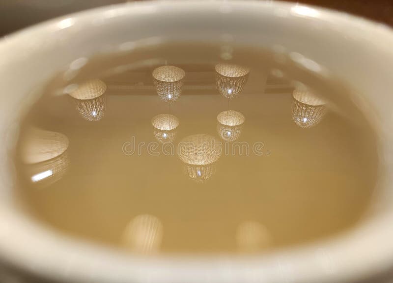 Lights Reflection in a Cup of Tea Background Stock Photo - Image of ...