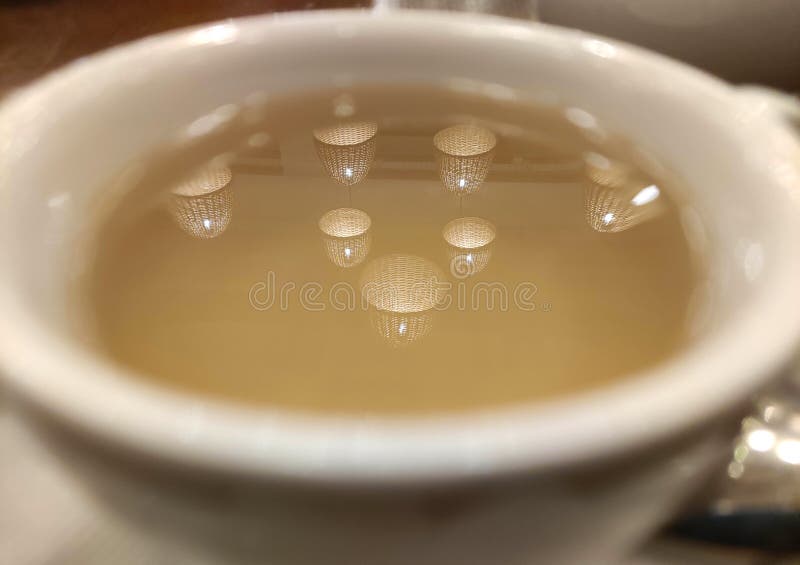Lights Reflection in a Cup of Tea Background Stock Image - Image of ...
