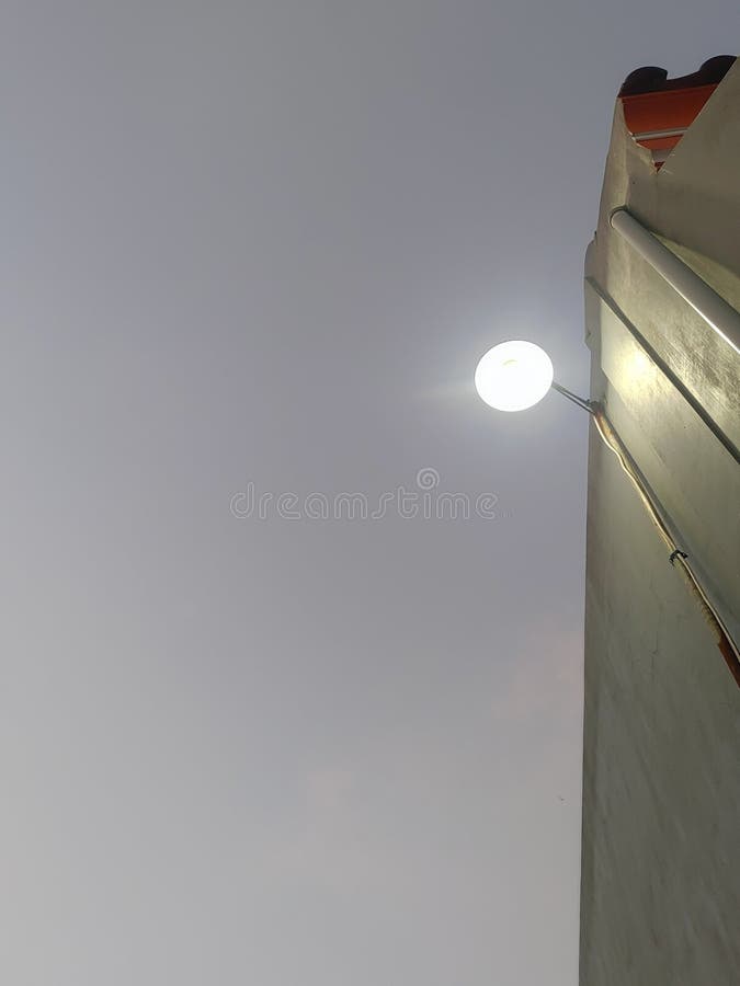 The Lights are Starting To Turn on the Sign of the Day is Getting Dark ...