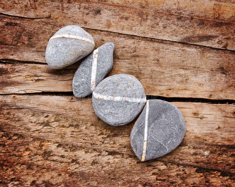 Lign of stones on wood stock photo. Image of focus, pebble - 51243140