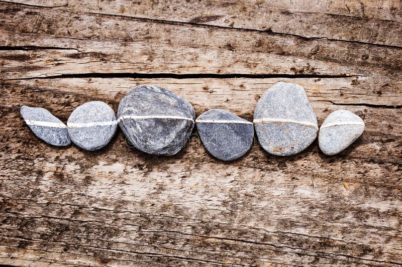 Lign of stones on wood stock photo. Image of focus, balanced - 51243378